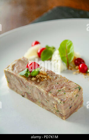 plated pork terrine starter with cranberries Stock Photo - Alamy