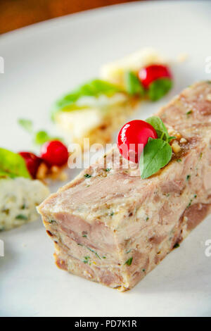 plated pork terrine starter with cranberries Stock Photo - Alamy