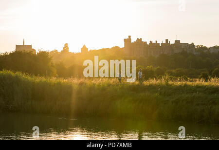 Couple taking an evening stroll down the banks of the Kamogawa River ...