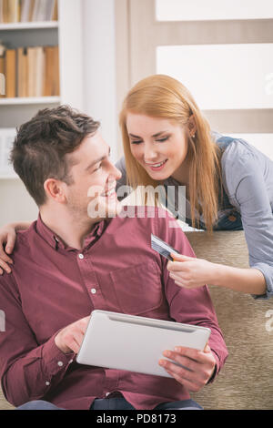 Happy couple doing on-line shopping with credit card Stock Photo - Alamy