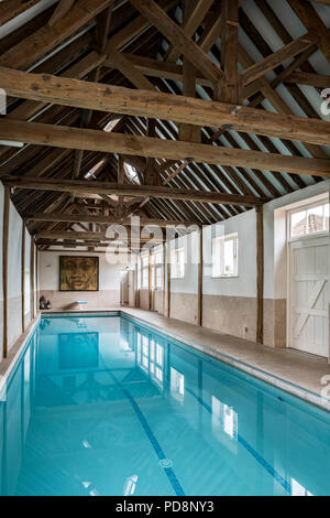Indoor swimming pool in barn conversion with beautiful timbers Stock ...