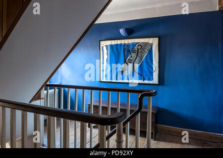 First floor landing with walls painted in strong blue Stock Photo - Alamy