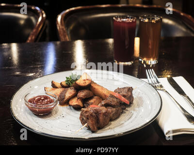 shish kebab with fried potato Stock Photo - Alamy