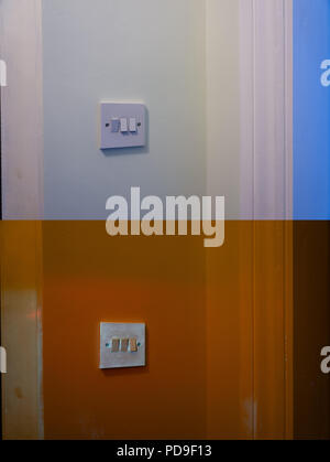 Seemingly clean light switch and wall is shown to be coated in body ...