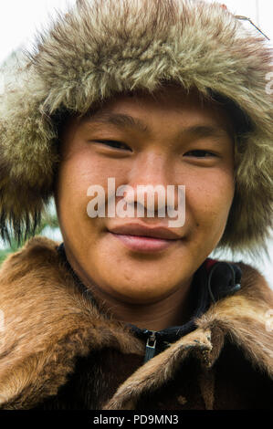 Koryak man, the native people of Kamchatka in front of a traditional ...