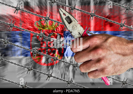 Serbia flag, migrants, border house and barb wire with pliers Stock ...