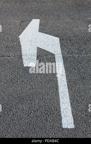 arrow painted on parking lot tarmac Stock Photo - Alamy