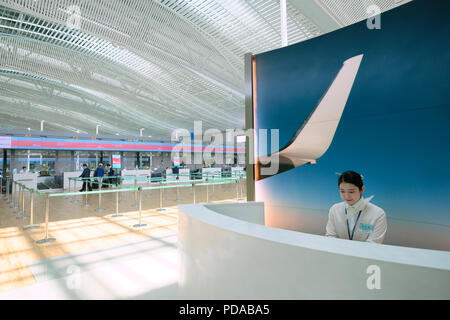 Departing passenger on his way to the Korean Air check-in counters at ...