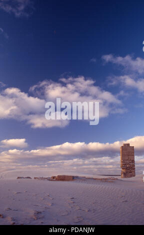 OLD TELEGRAPH STATION RUINS PARTIALLY BURIED BY ENCROACHING SAND DUNES ...