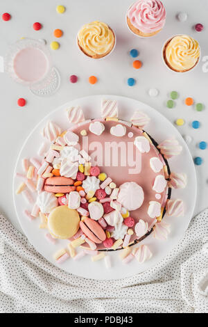 Sweet desserts for the holiday. Desserts: macaroons, marshmallows and ...