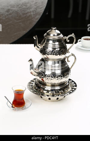 glass of Turkish tea and kettle isolated on white Stock Photo - Alamy