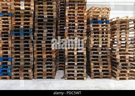 Used wooden Euro pallets in distribution warehouse Stock Photo - Alamy
