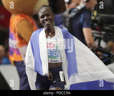 Lonah Chemtai Salpeter, of Israel, celebrates her third place finish in ...