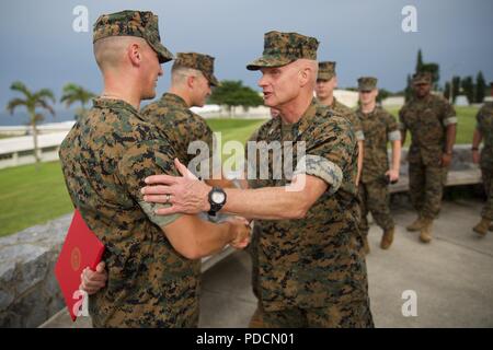 Sgt. Alexander J. Kraska and Sgt. Andrew M. Rief are congratulated by ...