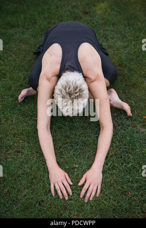 Woman doing Utthita Balasana (Extended Child'S Pose Stock Photo - Alamy