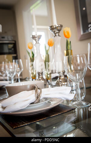 Beautiful table setting with napkins and glasses in stylish room Stock ...