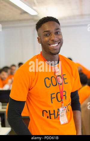 Portrait of professional hacker young man point pen clipboard computer ...