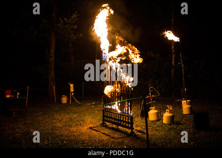 Pyrophone fire organ at night playing music trance Stock Photo - Alamy