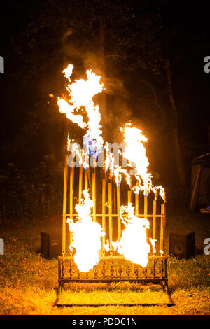 Pyrophone fire organ at night playing music trance Stock Photo - Alamy