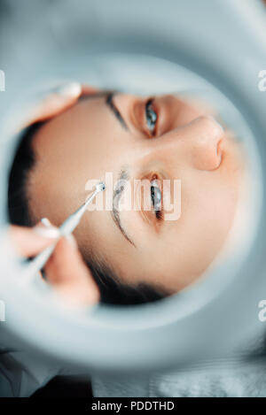 Skin care - magnifying glass Stock Photo - Alamy