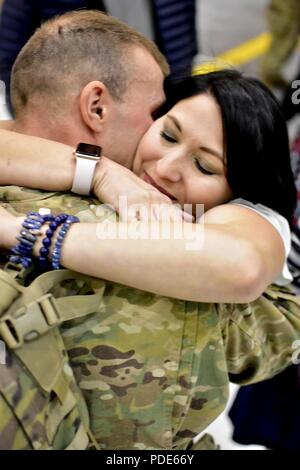 Brittany Rimgale reunites with her husband, Staff Sgt. Tim Rimgale, at ...