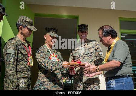 Col. David Key, commander of 3rd Division Sustainment Brigade, tosses ...