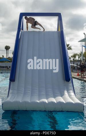 A U.S. Army Soldier begins an obstacle at DARBY QUEEN obstacle course ...