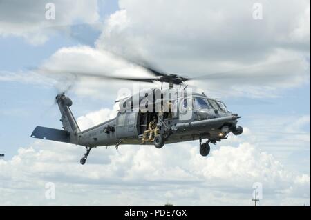 US Navy Pilots prepare their HH-60H Seahawk helicopter to lift off from ...