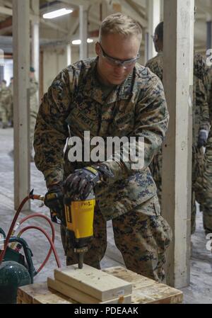British Royal Marine Cpl. Michael Dowd, an armored support group team ...