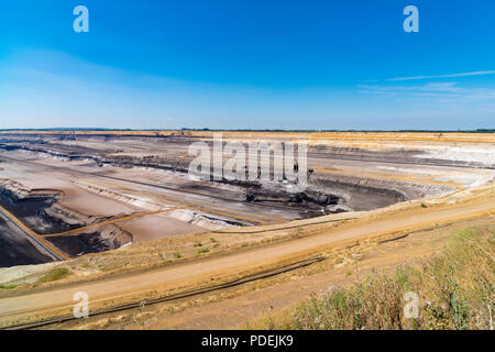 enormous bucket-wheel excavator in an open pit lignite brown-coal mine ...