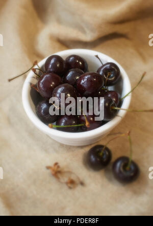 Appetising fresh Morello Cherries on wooden table top Stock Photo - Alamy