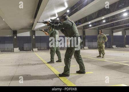 A Customs and Border Protection officer watches operations of a VACIS ...