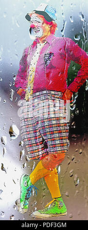 Clown in funny concept on dark background Stock Photo - Alamy