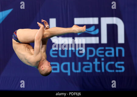 Russia's Evgenii Kuznetsov in action in the Men's 3m Springboard diving ...