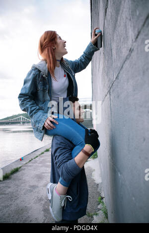 Joyful nice woman having fun together with her husband Stock Photo - Alamy