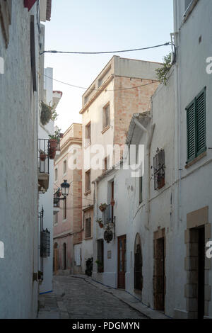 Traditional alley in spanish small town on a sunny summer day with ...