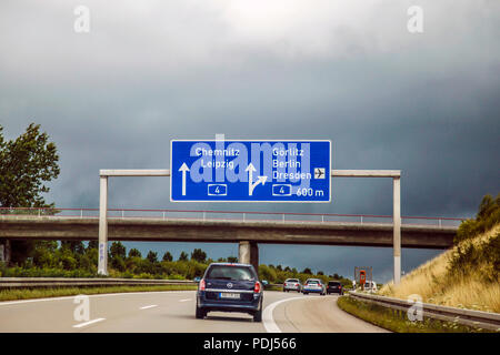 Blue overhead autobahn sign pointing to a intersection towards Leipzig ...