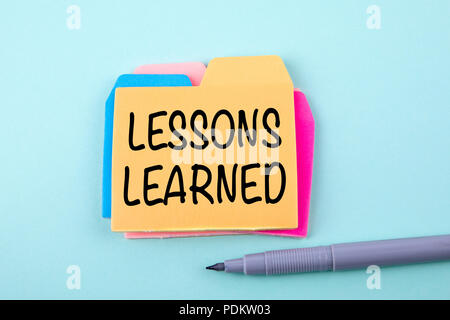 Lessons to learn symbol. Concept word Lessons learn on wooden cubes ...