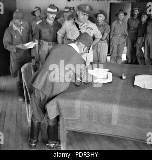 This historical photograph documents the Japanese surrender ceremony at ...