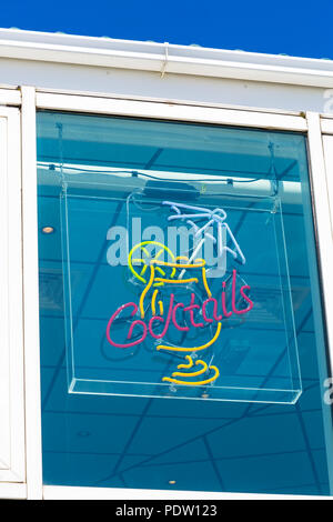 neon sign in the window,cocktail glass,attracting visitors, one object ...