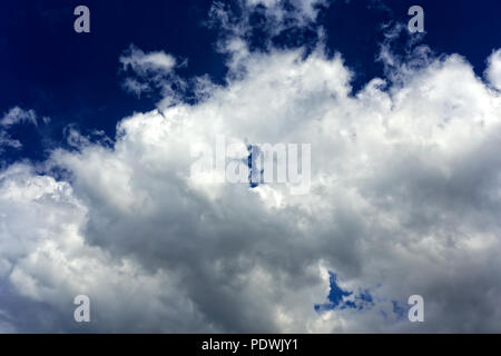 Strong white clouds against deep blue sky Stock Photo - Alamy