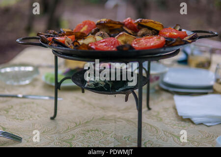 Saj kebap with mushrooms chicken. Outdoor picnic table Stock Photo - Alamy