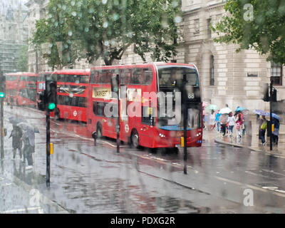 View through bus window of buses in bus station in the town centre ...