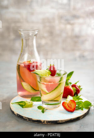 Refreshing ice cold summer dring with strawberry, cucmber and mint ...