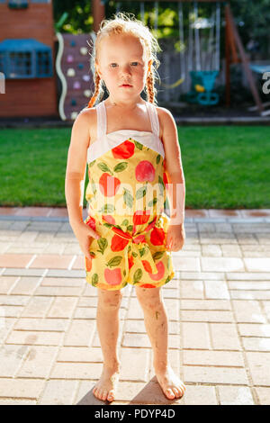 Wet Little Girl After Playing With The Water Jet In Swimsuit Stock