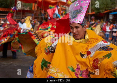 Members of a Waca Waca dance group in ornate costume parade through the ...