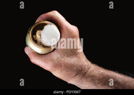 Beer can in hand on black background. Black and white Stock Photo - Alamy