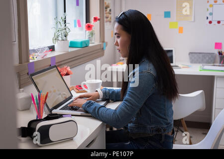 designer using laptop computer at home. view from top. free space for ...