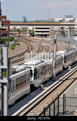 A freight train and the Union Station Light Rail stop at the new ...