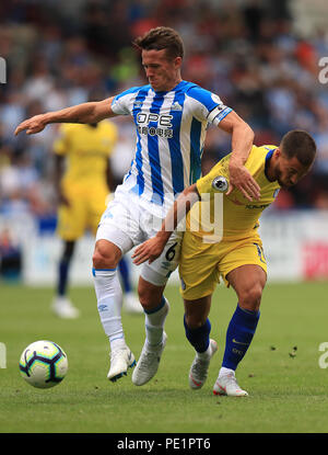 Chelsea's Eden Hazard (left) and Huddersfield Town's Aaron Mooybattle ...